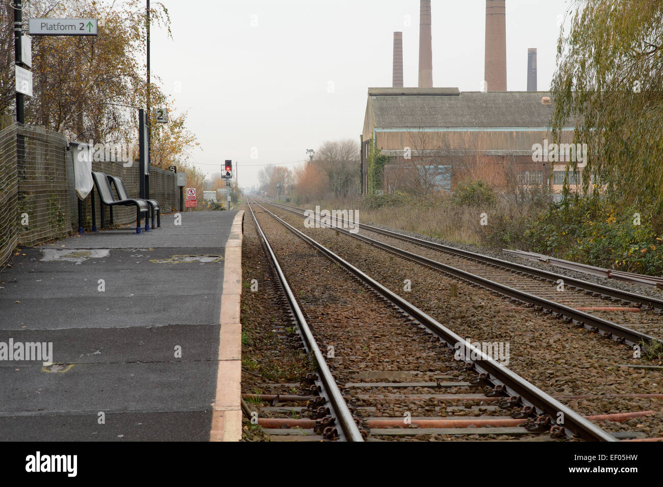 Factory with tall chimneys situated next to Millbrook Railway Station ...