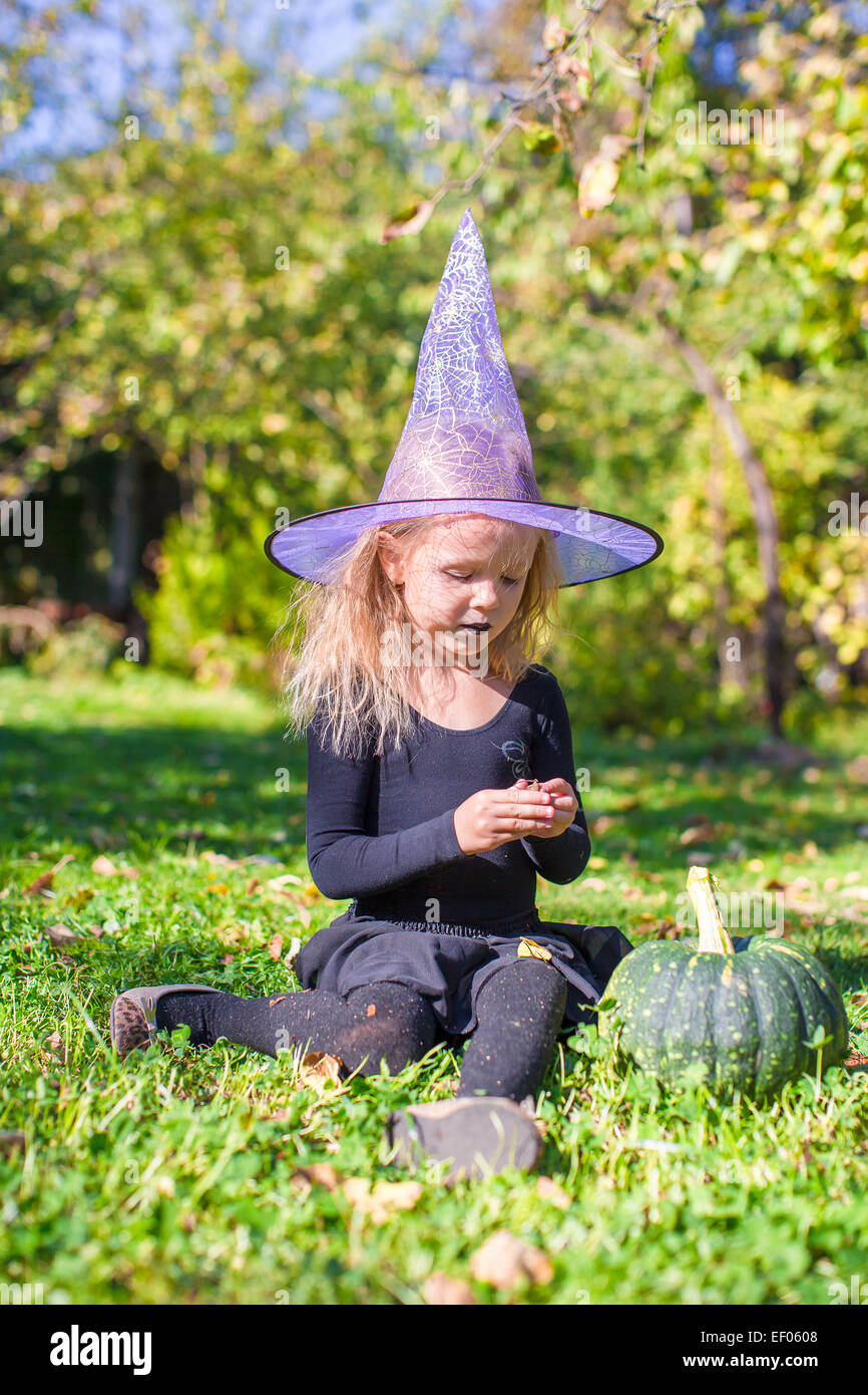 Cute little girl in Halloween which costume have fun outdoor Stock ...