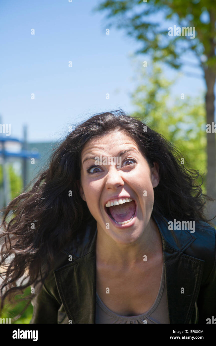 angry woman shouting to camera at exterior background Stock Photo - Alamy