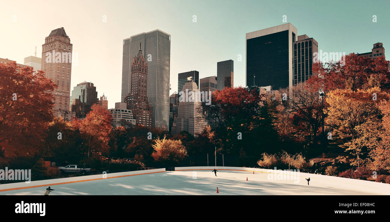 Central Park Autumn ice rink midtown skyline in Manhattan New York City ...