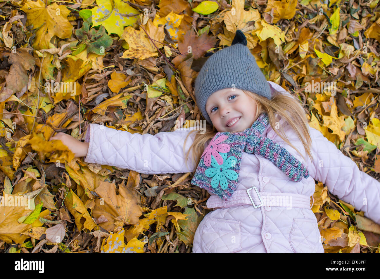 Adorable little girl outdoors at beautiful autumn day Stock Photo - Alamy