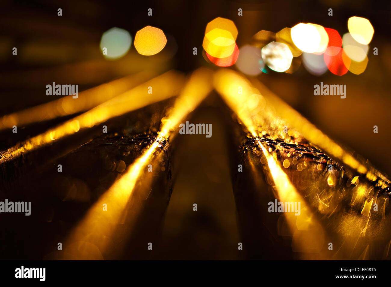 A park bench at night in the rain Stock Photo - Alamy