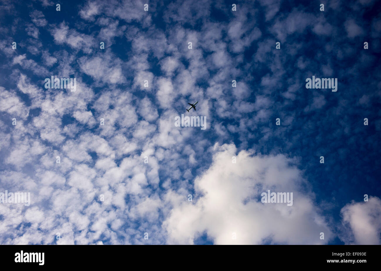 A jet plane flies overhead after takeoff from the Miami International ...
