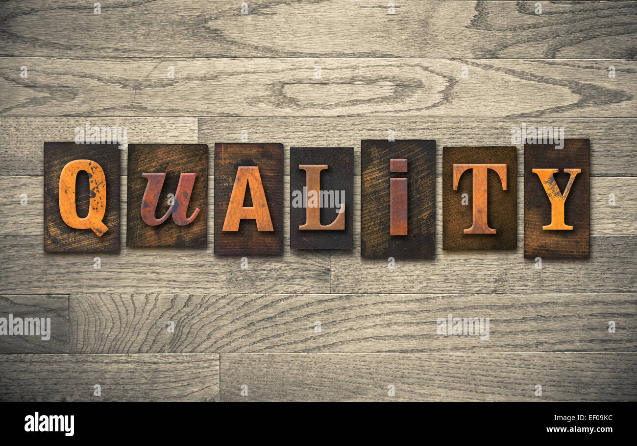 The word "QUALITY" written in vintage wooden letterpress type Stock ...