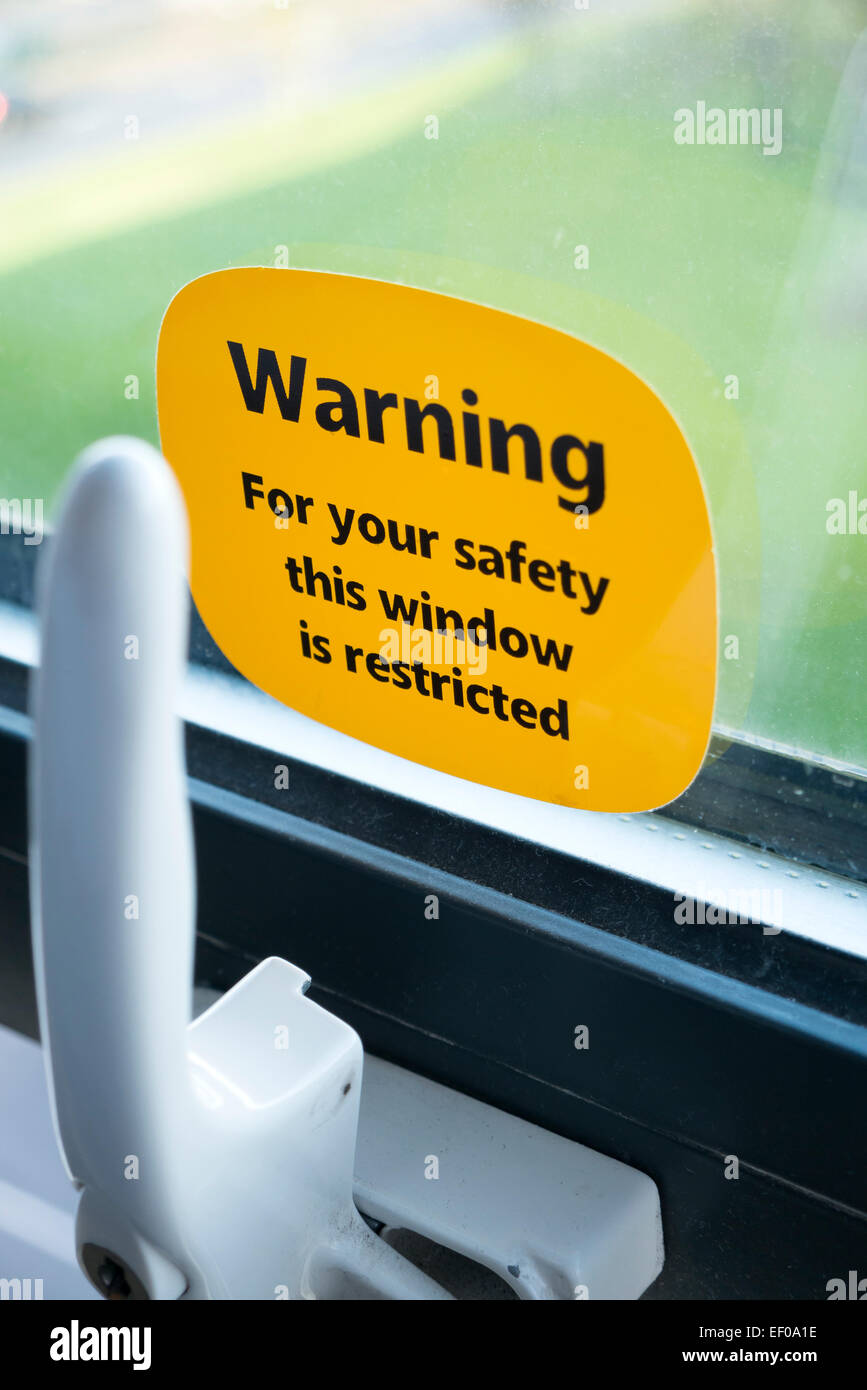 Warning sticker on restricted window Stock Photo - Alamy