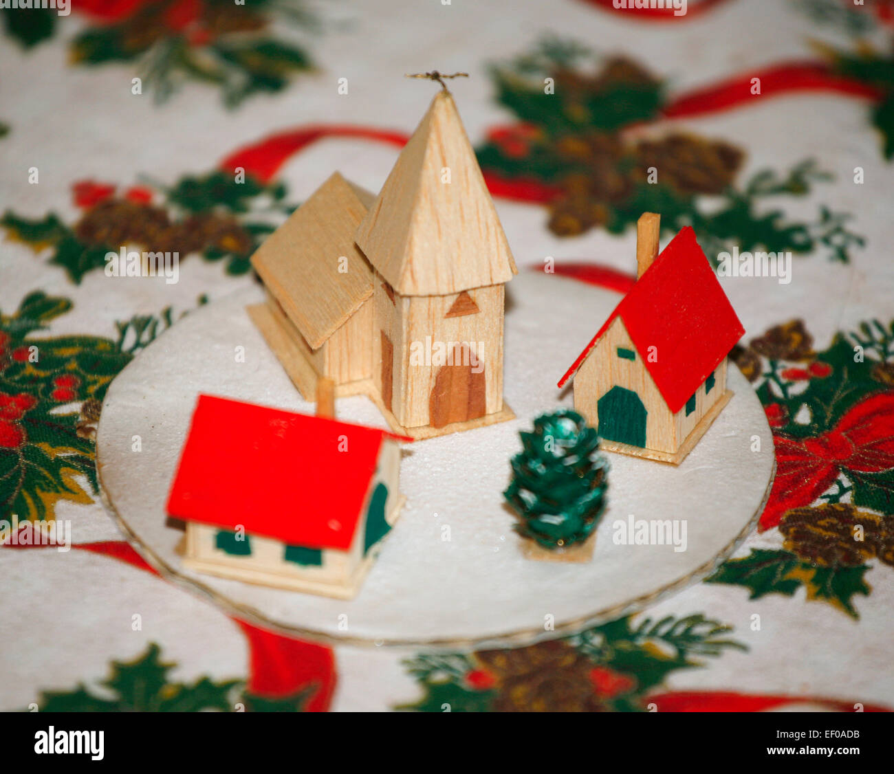 Miniature handmade village with houses christmas tree as a present ...