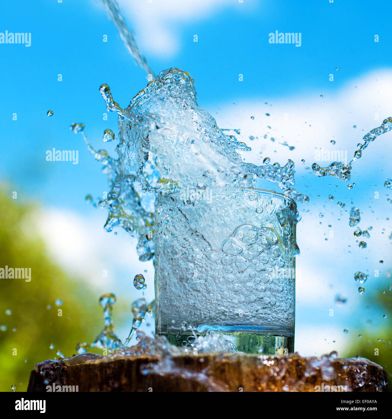 Splashing water from glass Stock Photo - Alamy