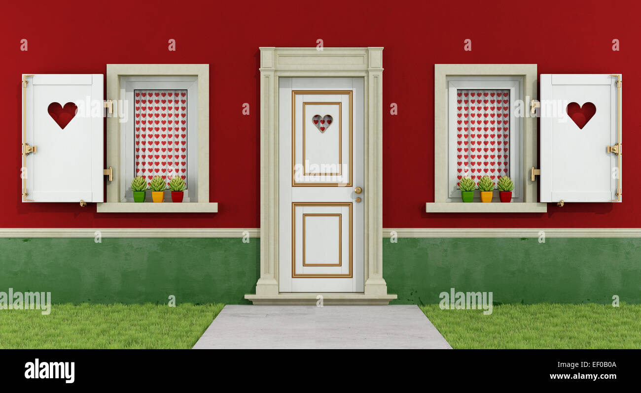 Detail of a romantic house with windows and front door decorated with ...