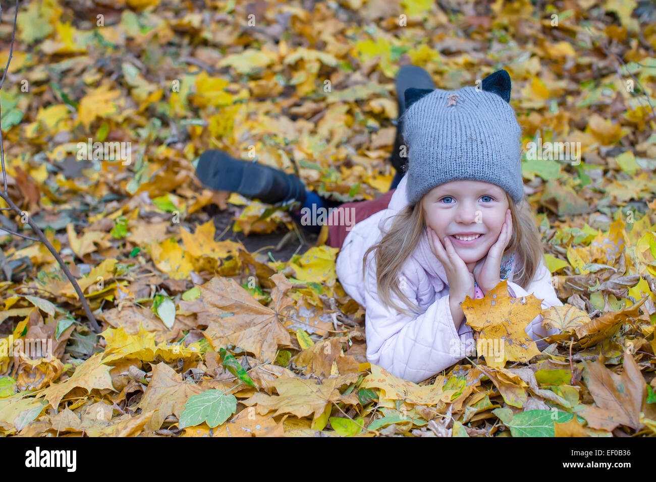 Adorable little girl at beautiful autumn day outdoors Stock Photo - Alamy