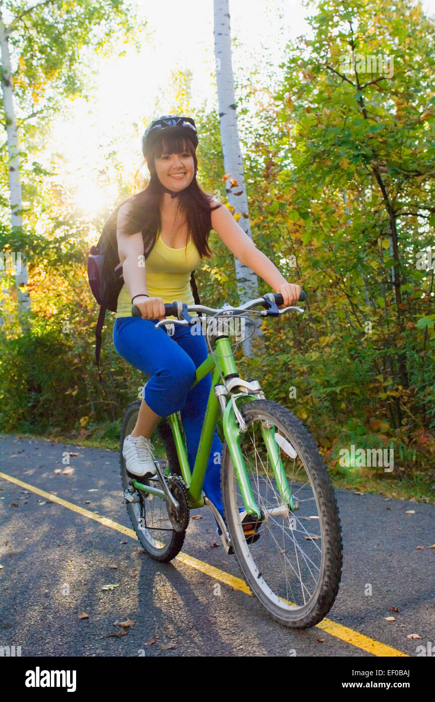 Cyclist riding on bike path Stock Photo - Alamy