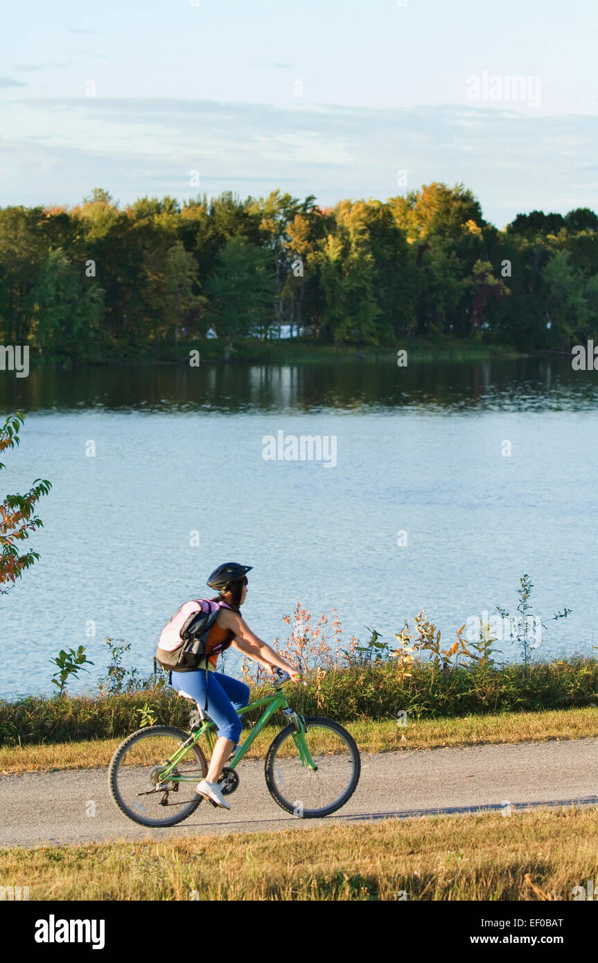 Cyclist riding on bike path Stock Photo - Alamy