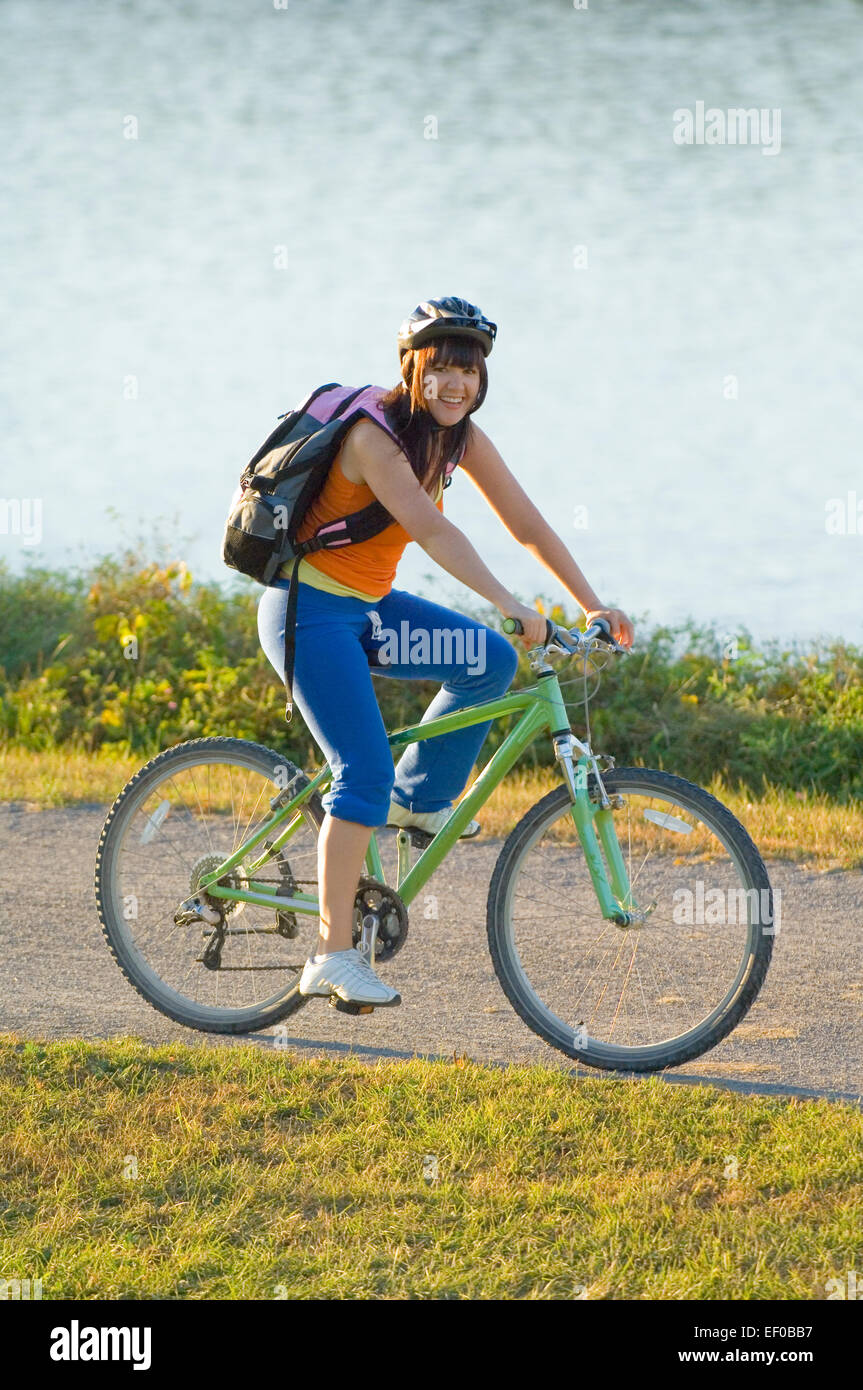 Cyclist riding on bike path Stock Photo - Alamy
