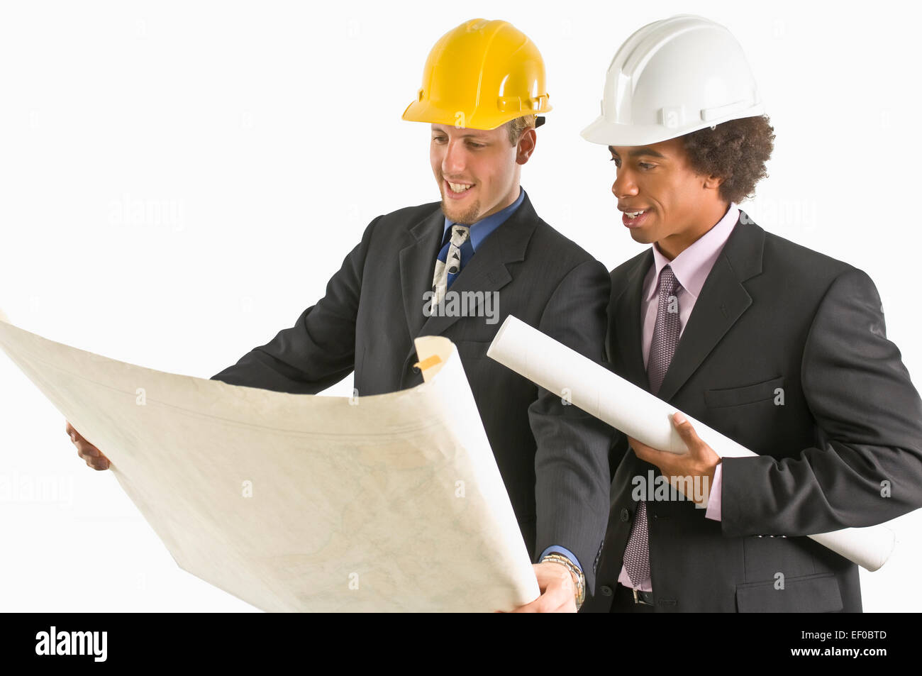 Group people architects reading papers hi-res stock photography and ...