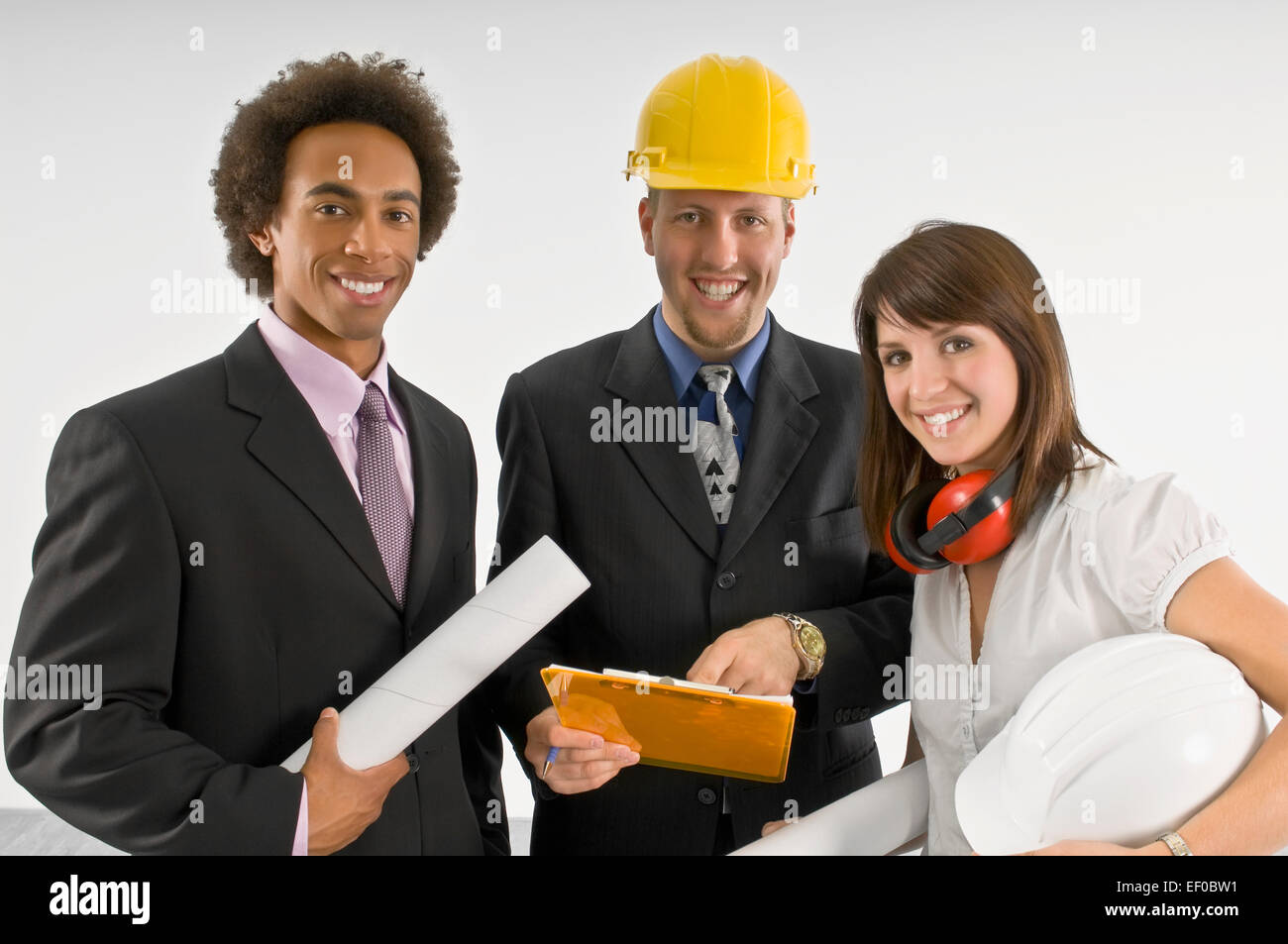Three business people standing together Stock Photo - Alamy