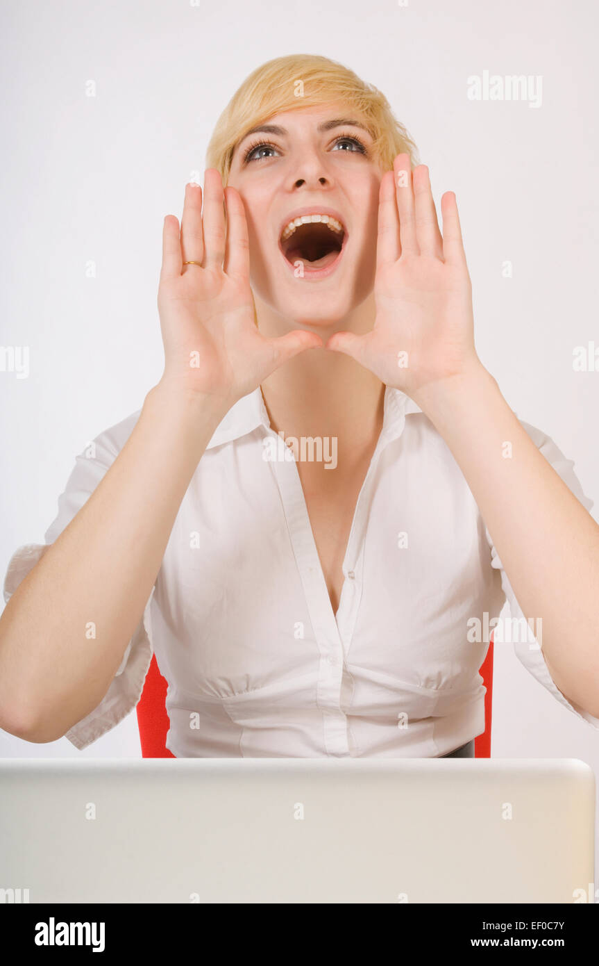 Blond woman yelling Stock Photo - Alamy