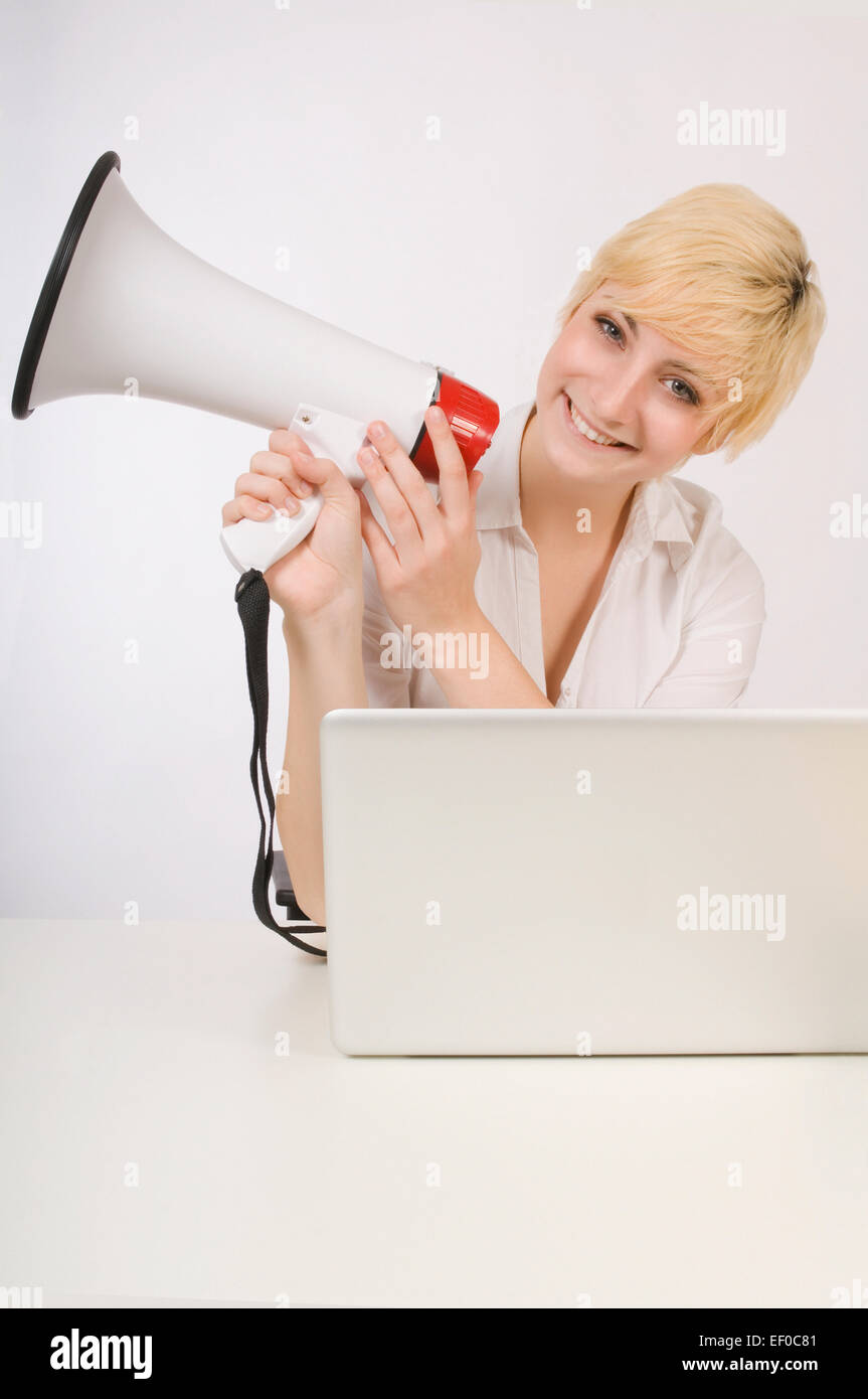 Blond woman holding a bullhorn Stock Photo - Alamy