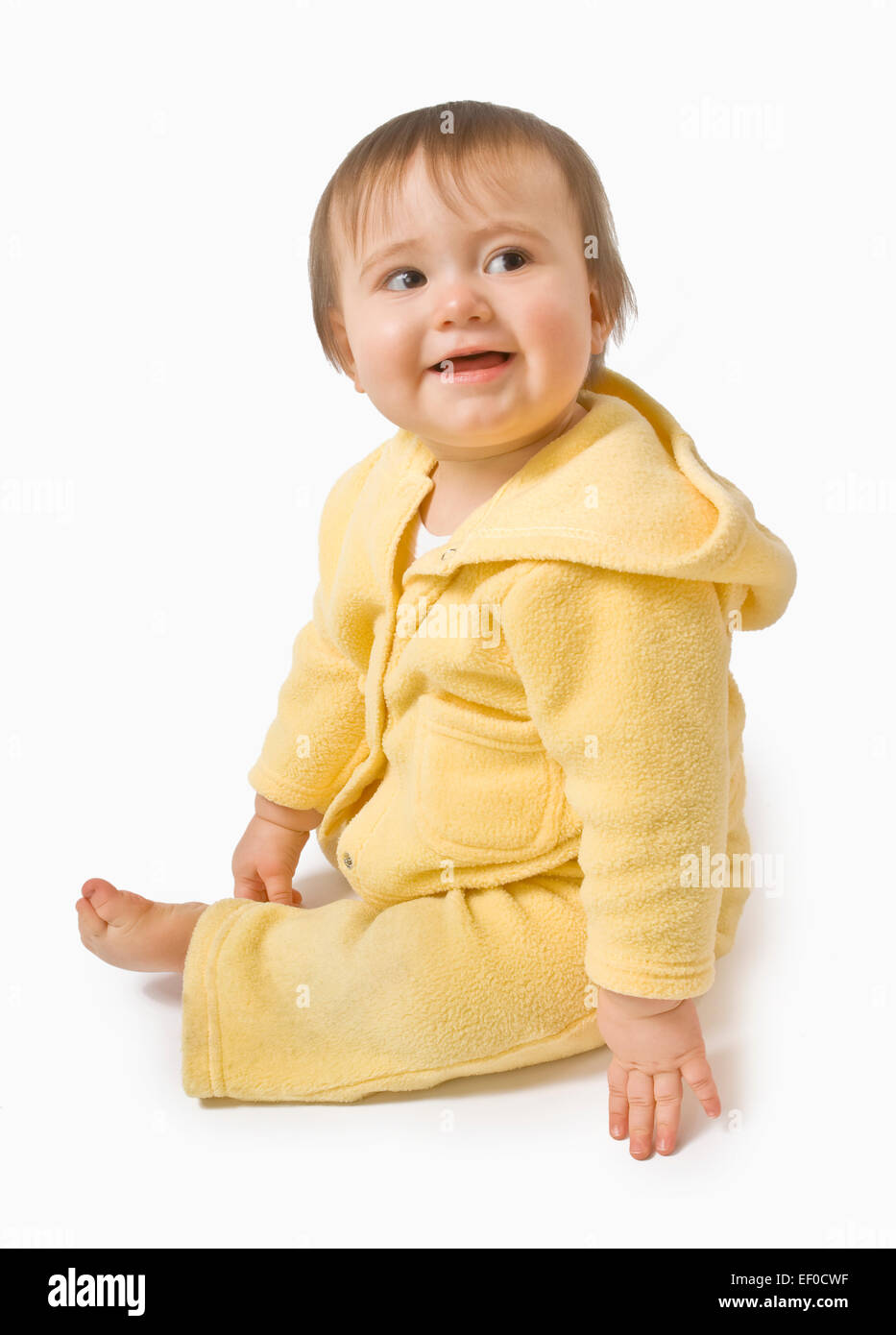 Toddler sitting alone Stock Photo - Alamy