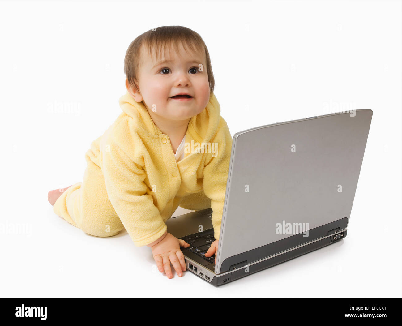 Toddler playing with laptop Stock Photo - Alamy