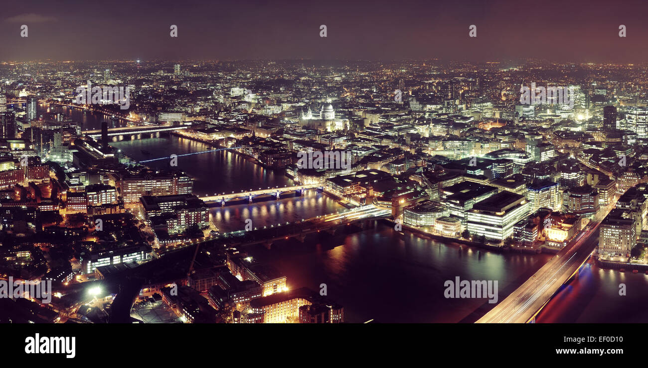 London aerial view panorama at night with urban architectures and ...