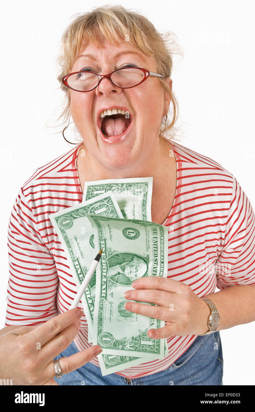 Excited woman holding money Stock Photo - Alamy