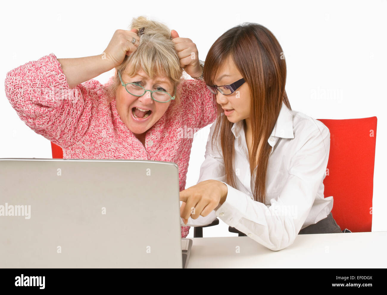 Student showing frustrated teacher how to use a computer Stock Photo ...