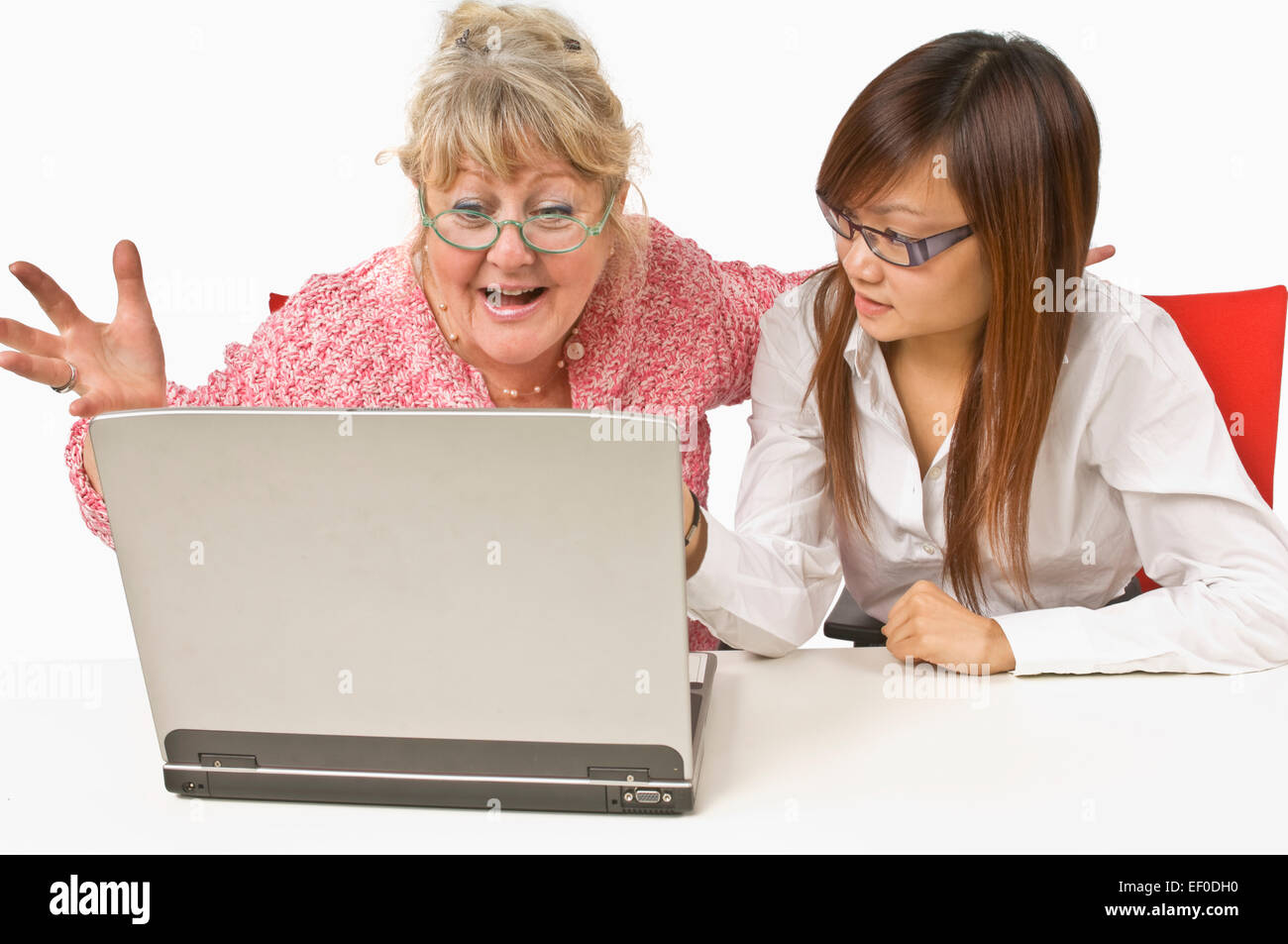 Student showing teacher how to use a computer Stock Photo - Alamy
