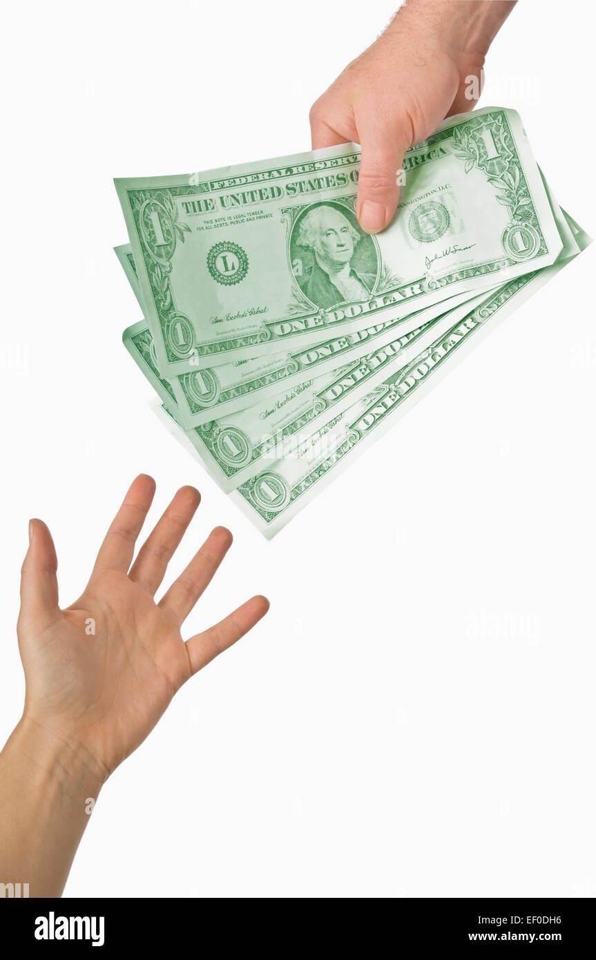 Hands passing dollar bills Stock Photo - Alamy