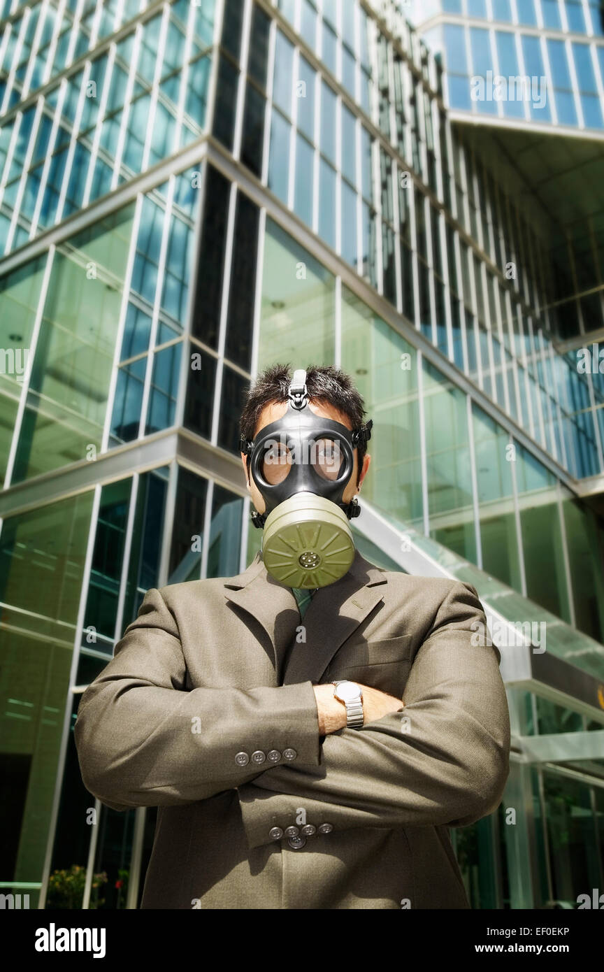 Man wearing a gas mask outside on office tower Stock Photo - Alamy