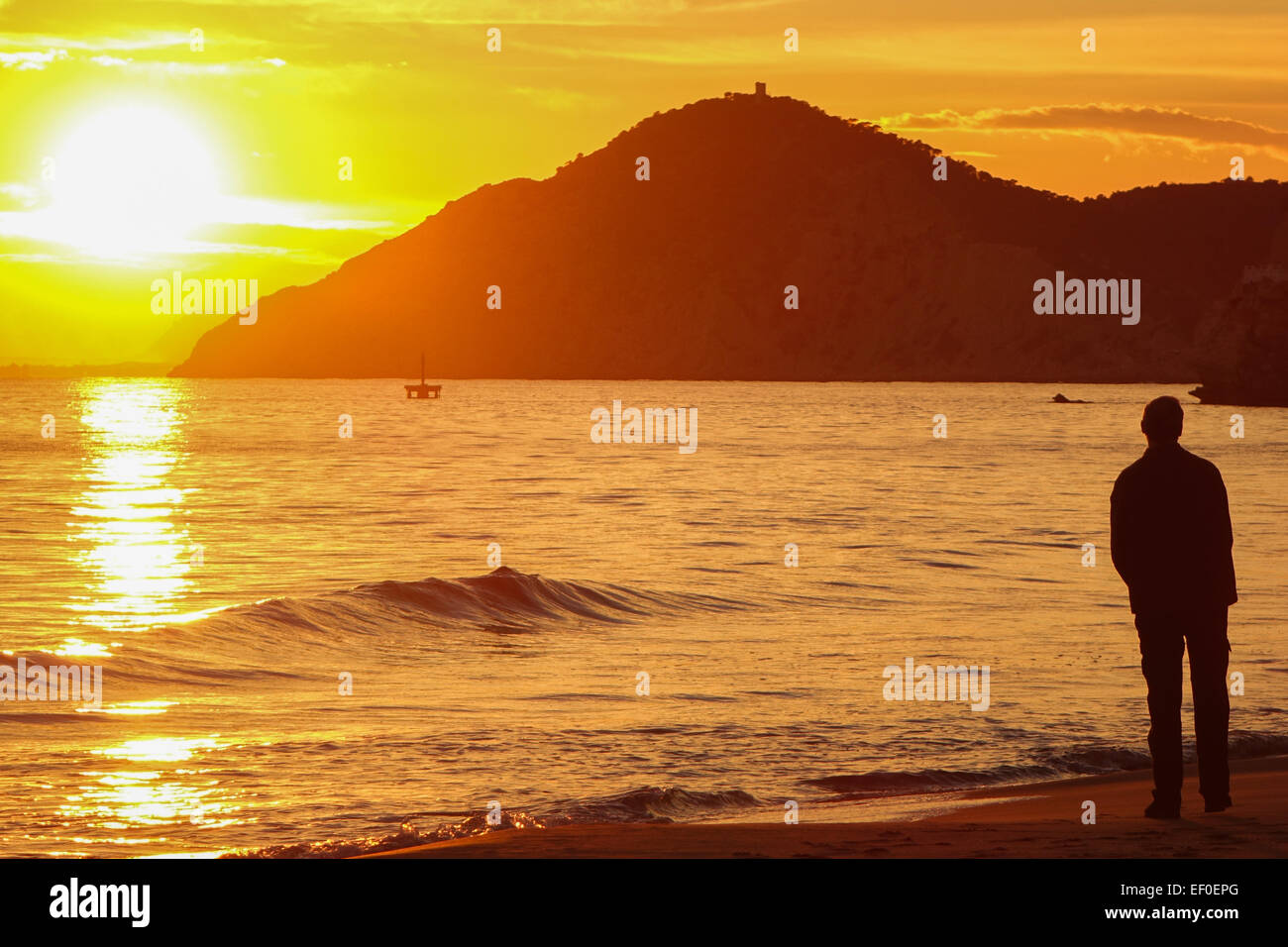Benidorm sunset, orange with sea, sand, silhouettes and clouds Stock ...