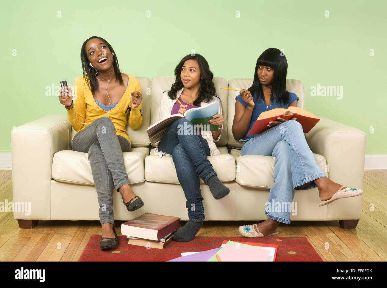 Students doing homework in living room Stock Photo - Alamy