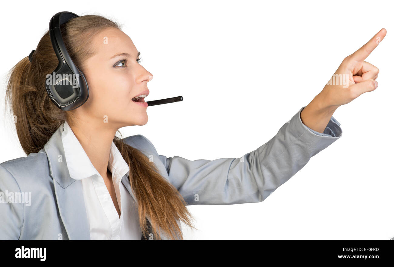 Businesswoman in headset touching or pressing something Stock Photo - Alamy