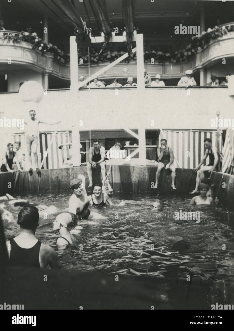 This photograph shows passengers swimming in the pool aboard the St ...