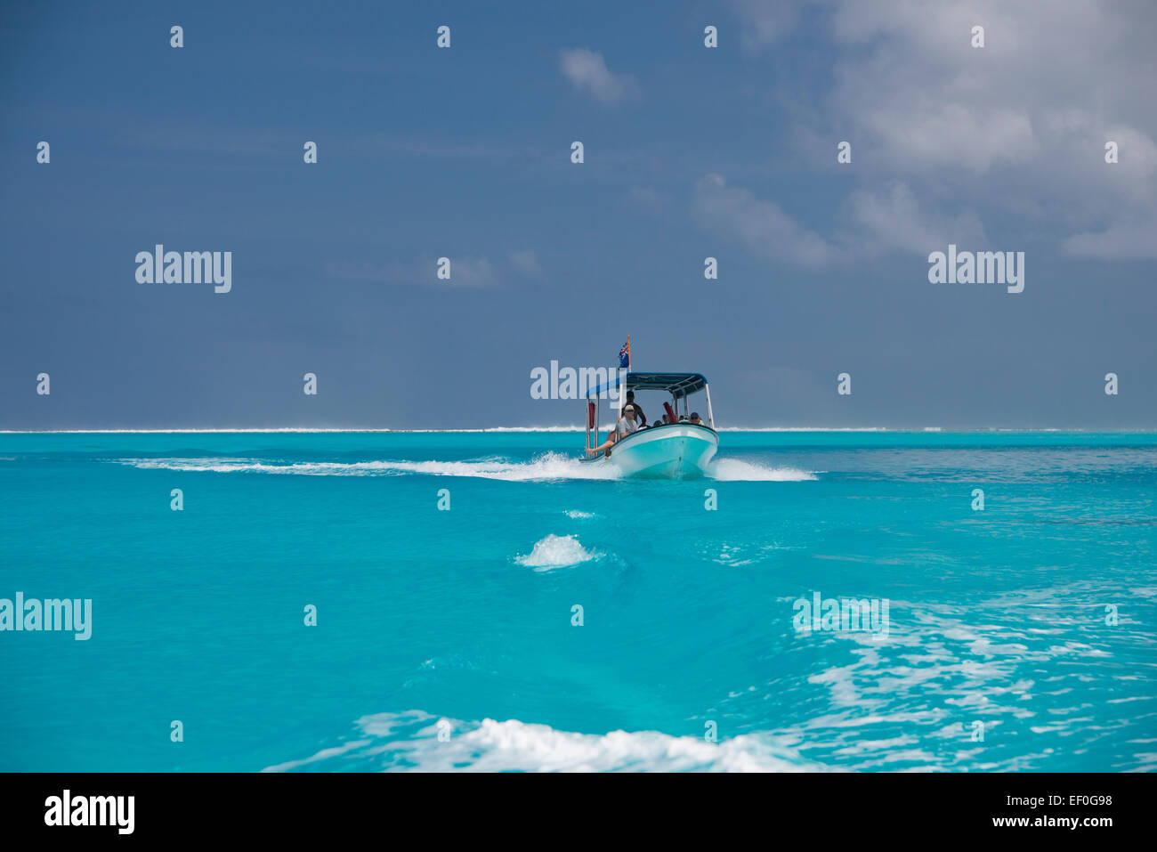 Cook Islands, Aitutaki. Tourist boat island hopping across the clear ...
