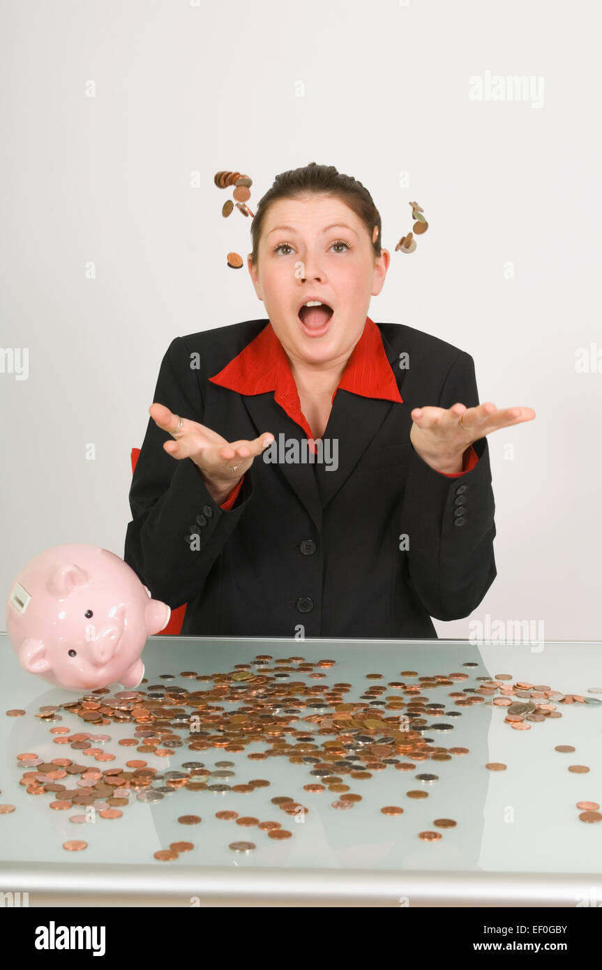 Businesswoman throwing pennies Stock Photo - Alamy