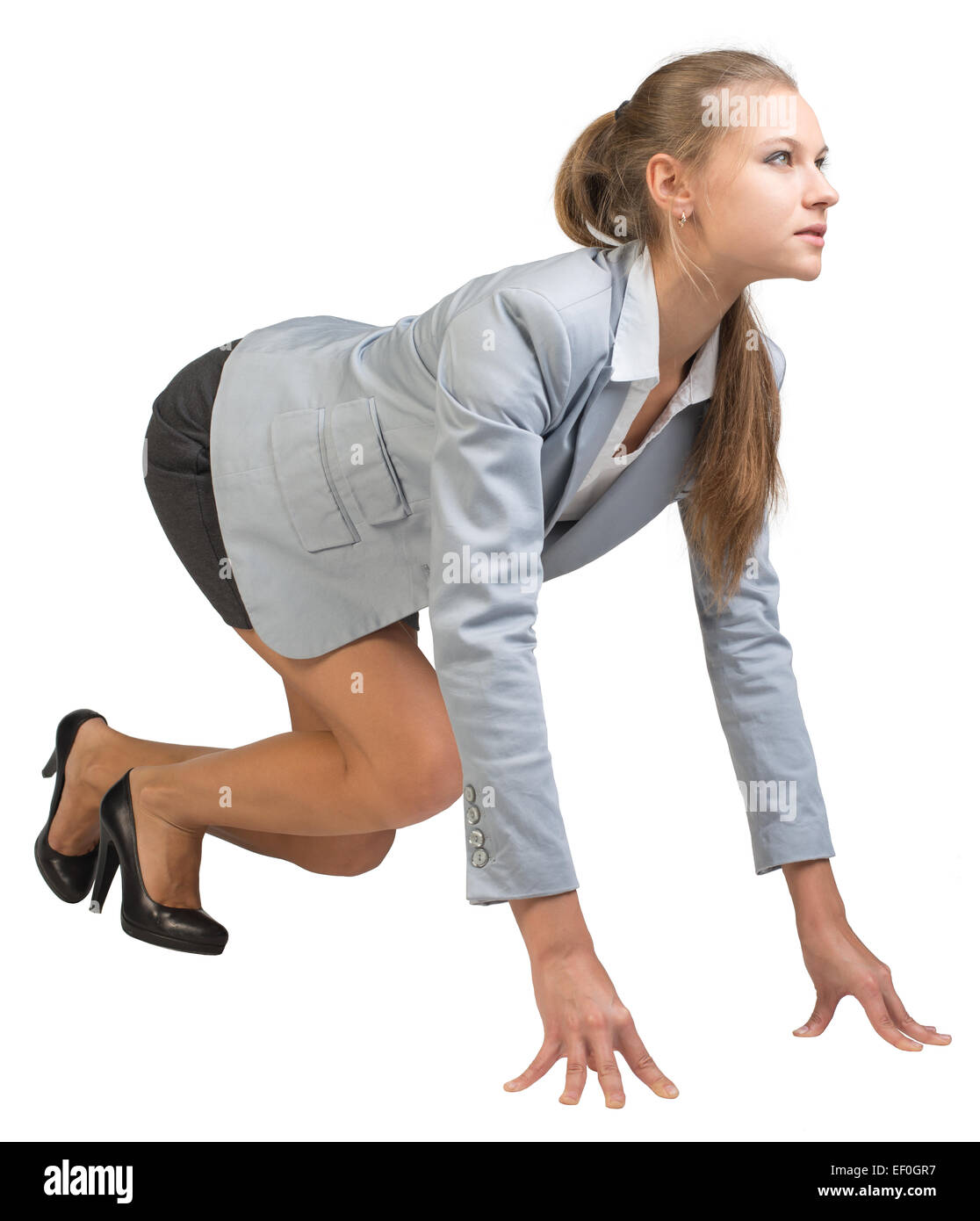 Businesswoman standing in running start pose Stock Photo - Alamy