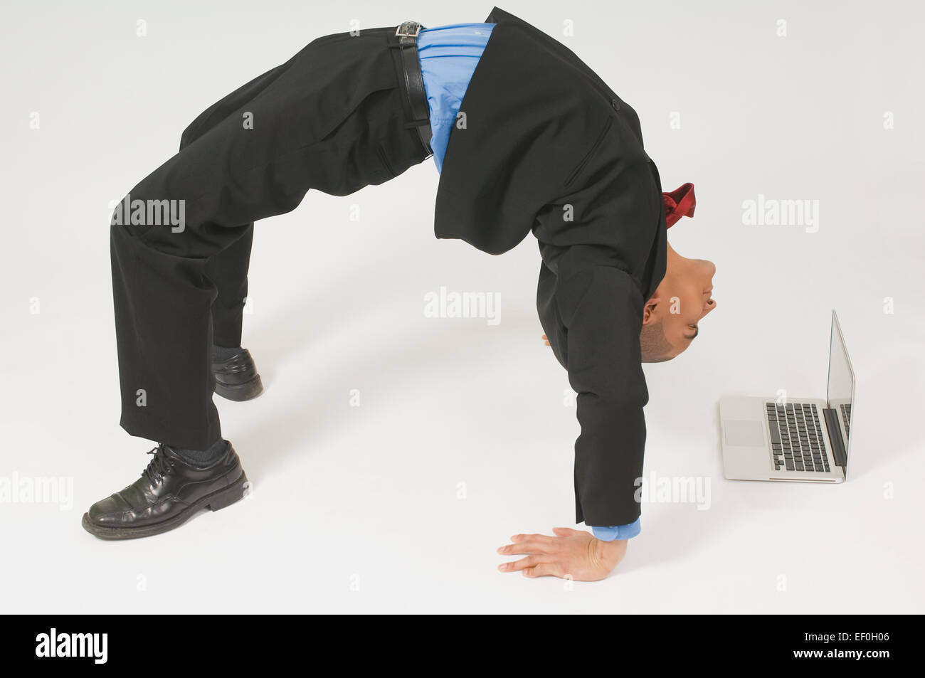 Business man bending over backwards hi-res stock photography and images ...