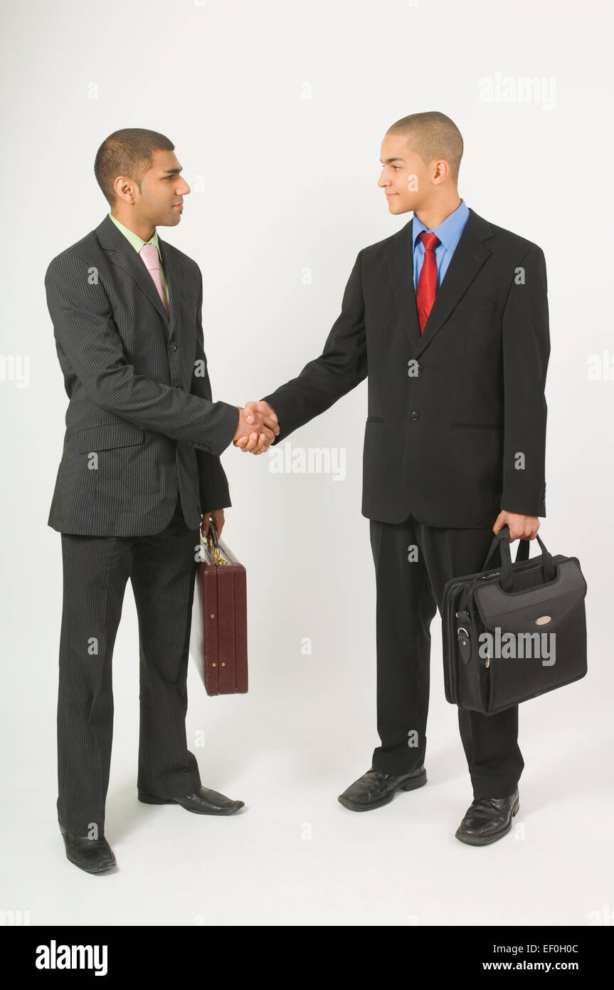 Businessmen shaking hands Stock Photo - Alamy