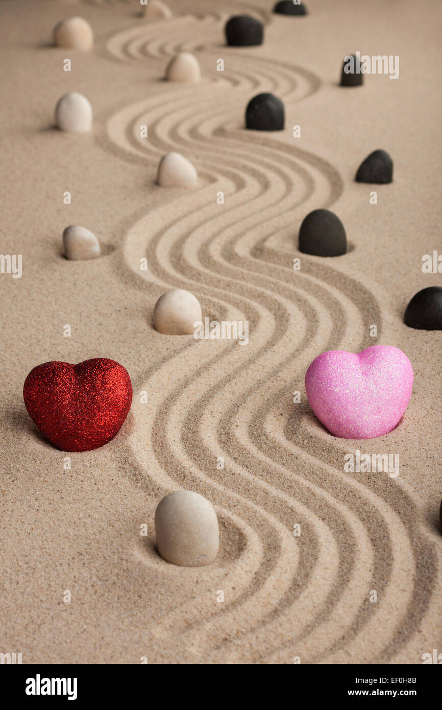 Two conceptual heart in the sand, can be used as background Stock Photo ...