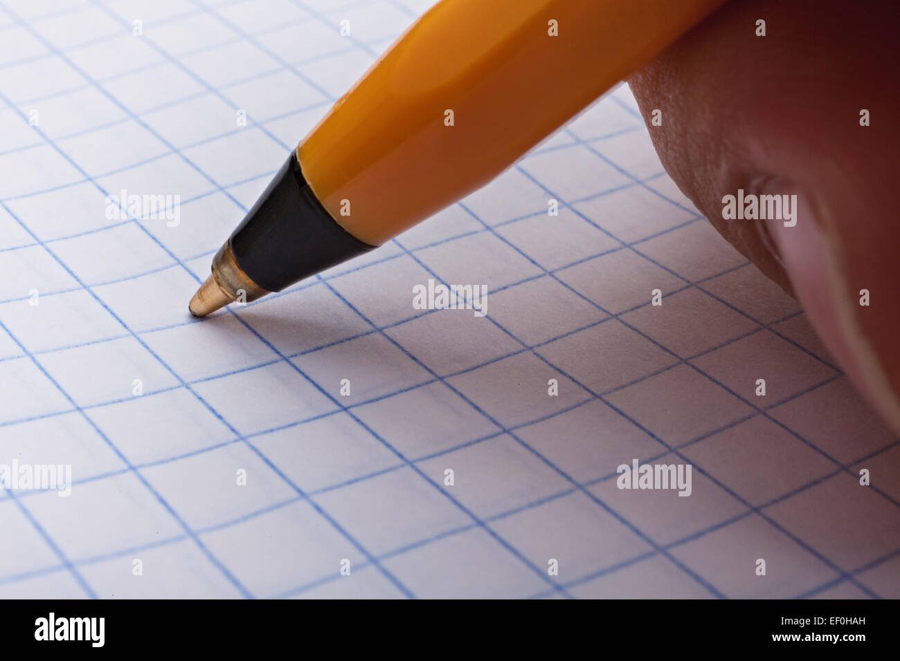 Man's hand making a pen writing in a notebook closeup Stock Photo - Alamy