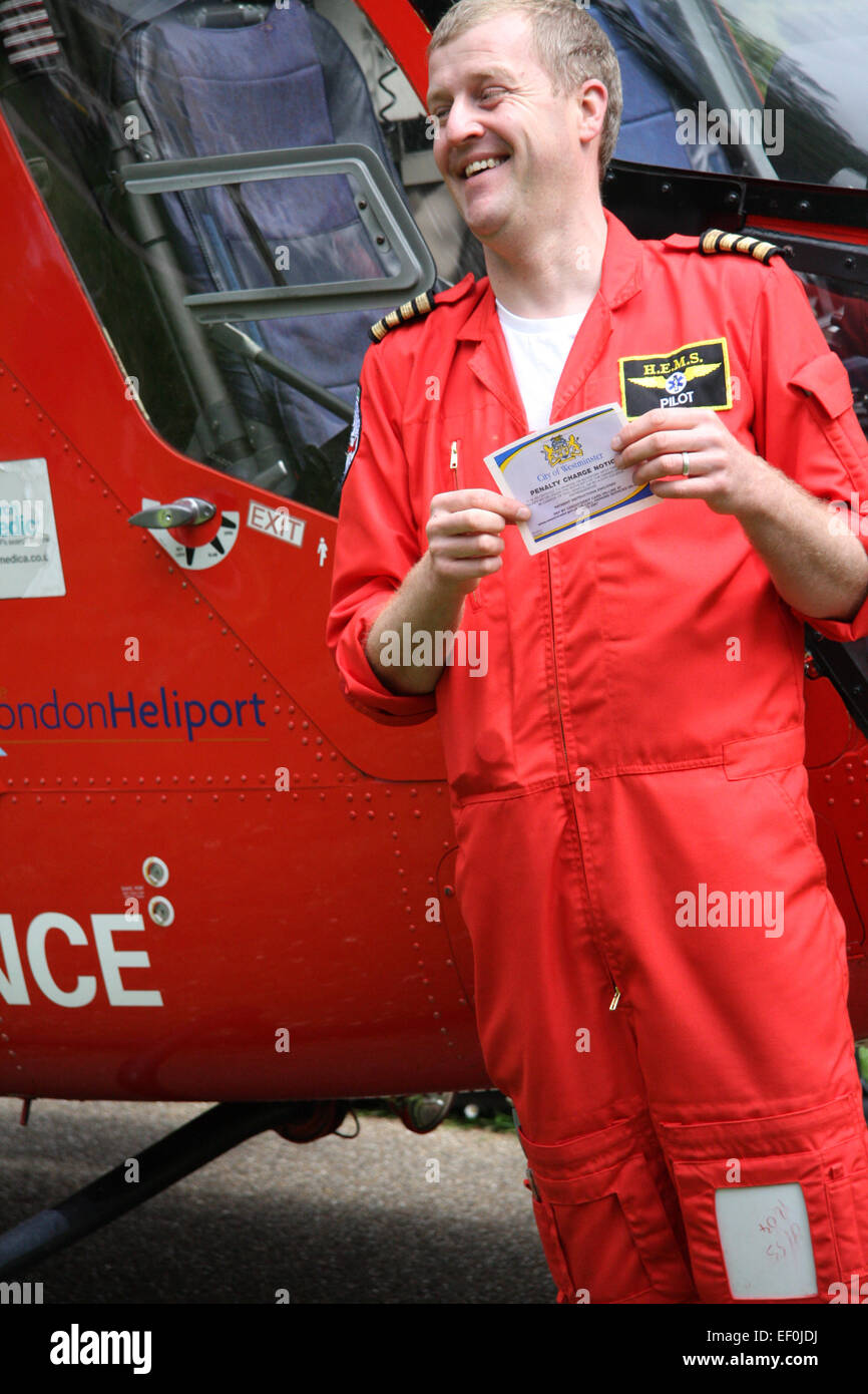 Air Ambulance, landing in Cavendish square London, pilot Holding ...