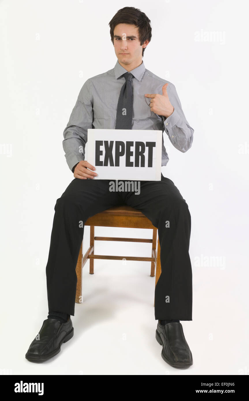 Businessman holding expert sign hi-res stock photography and images - Alamy