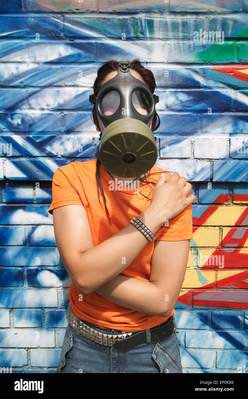 Woman wearing a gas mask against graffiti Stock Photo - Alamy