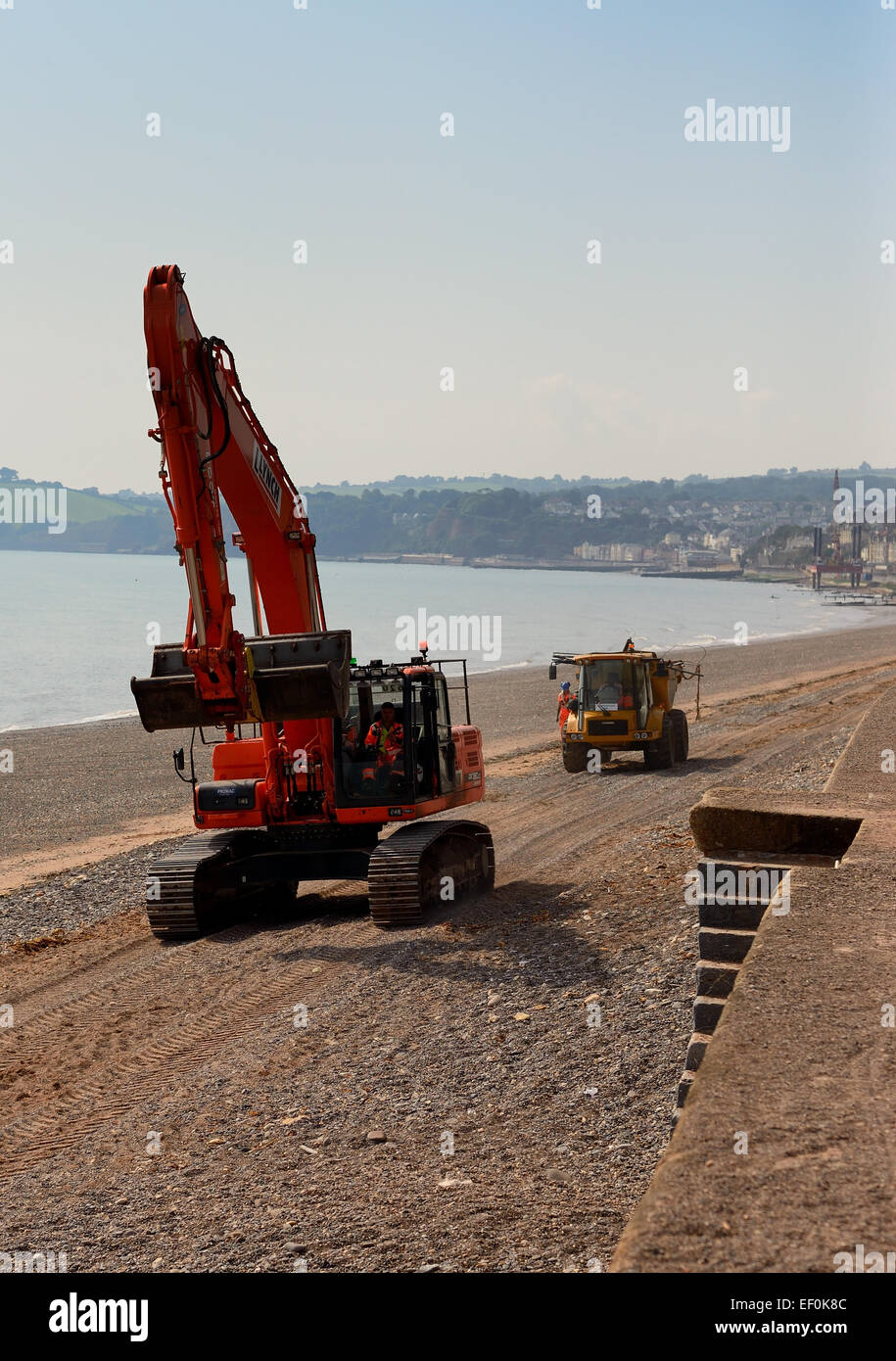 Earth moving equipment on the beach Stock Photo - Alamy