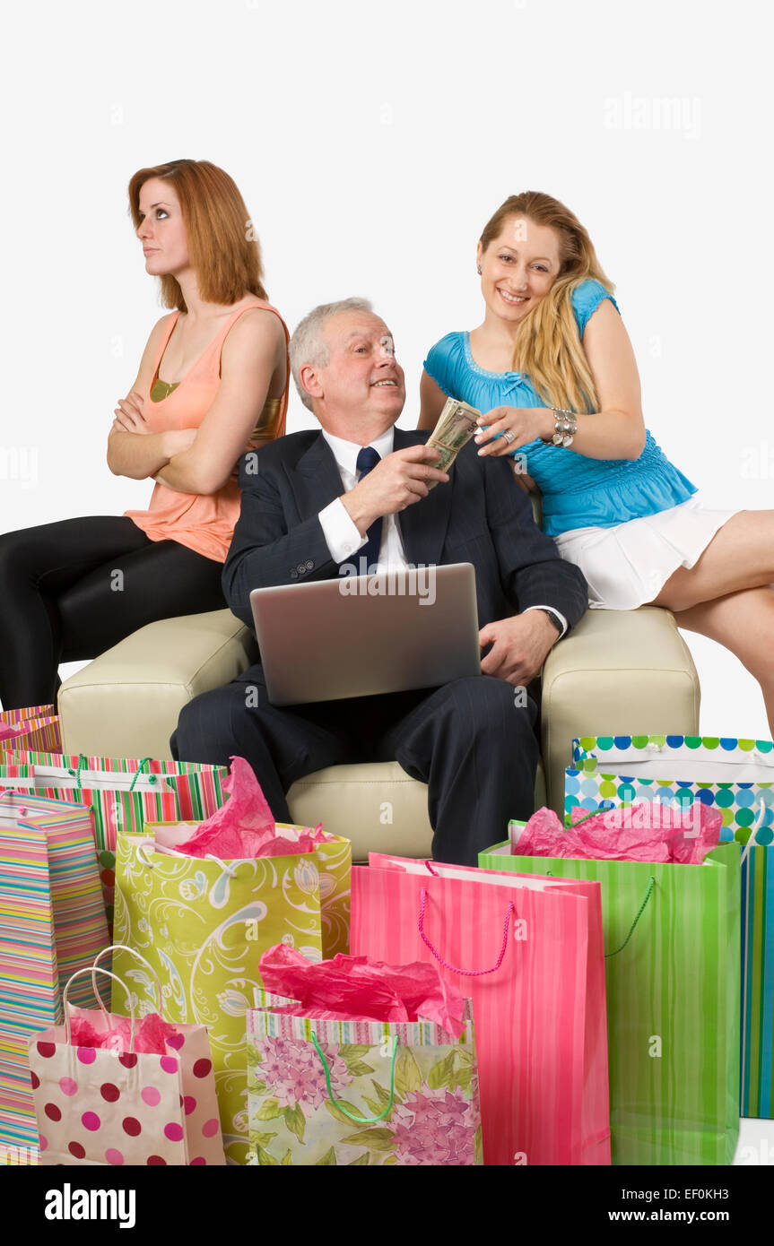 Man handing money to woman Stock Photo - Alamy