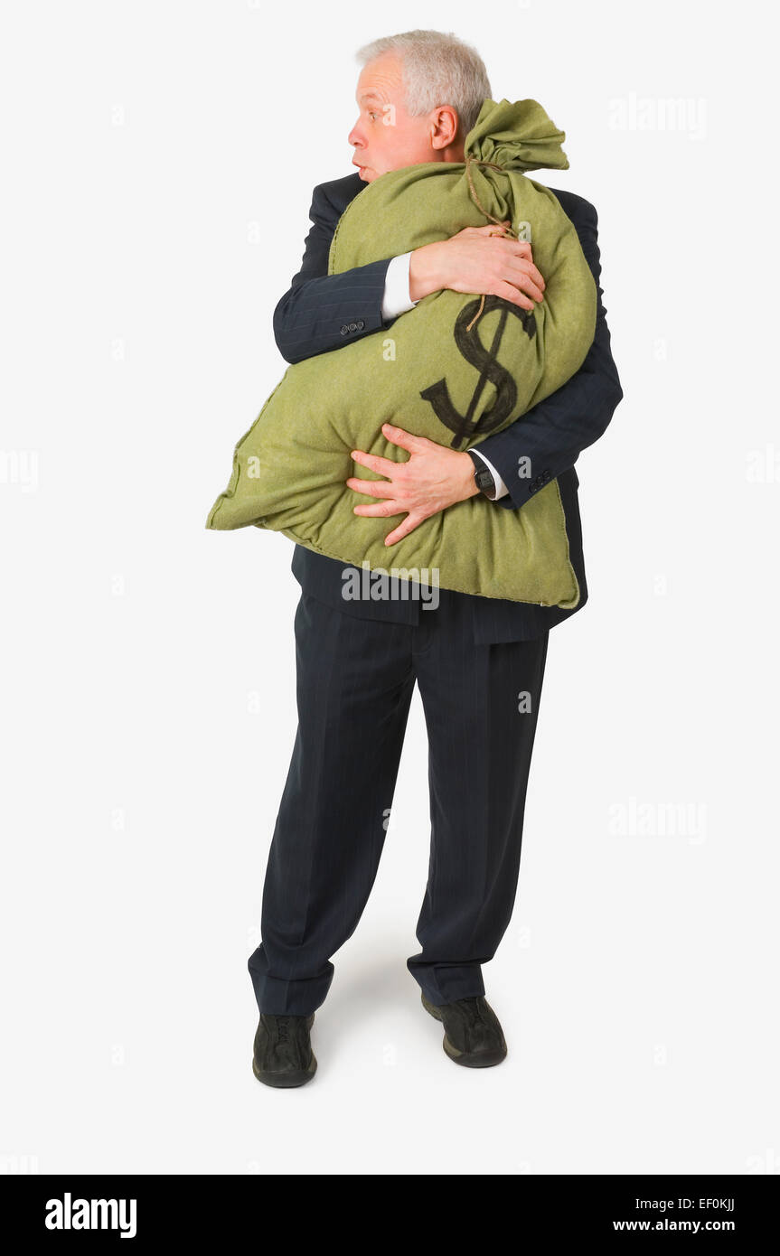 Clutching money hi-res stock photography and images - Alamy