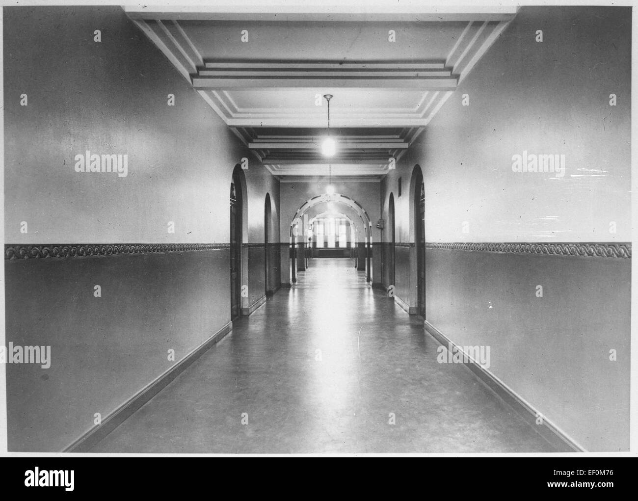 The corridor of a main building is depicted, showcasing the interior ...