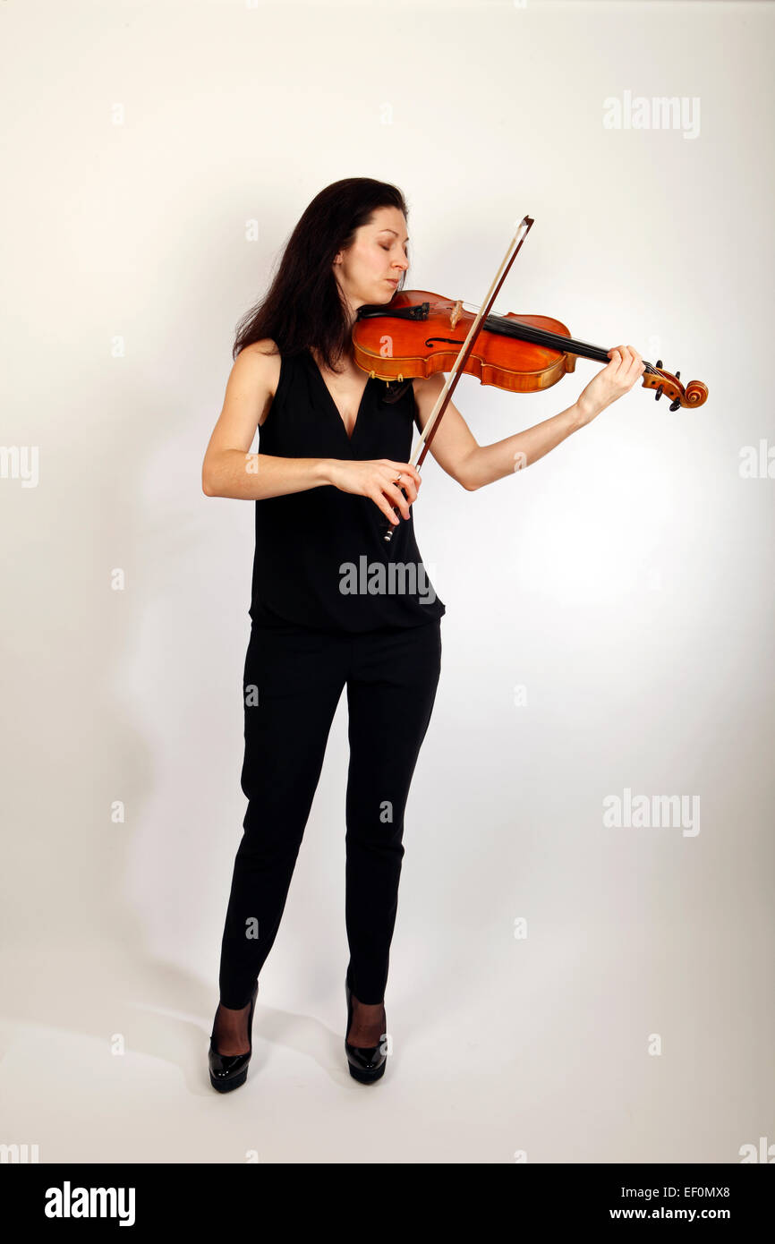 Viola player, playing her musical instrument Stock Photo - Alamy