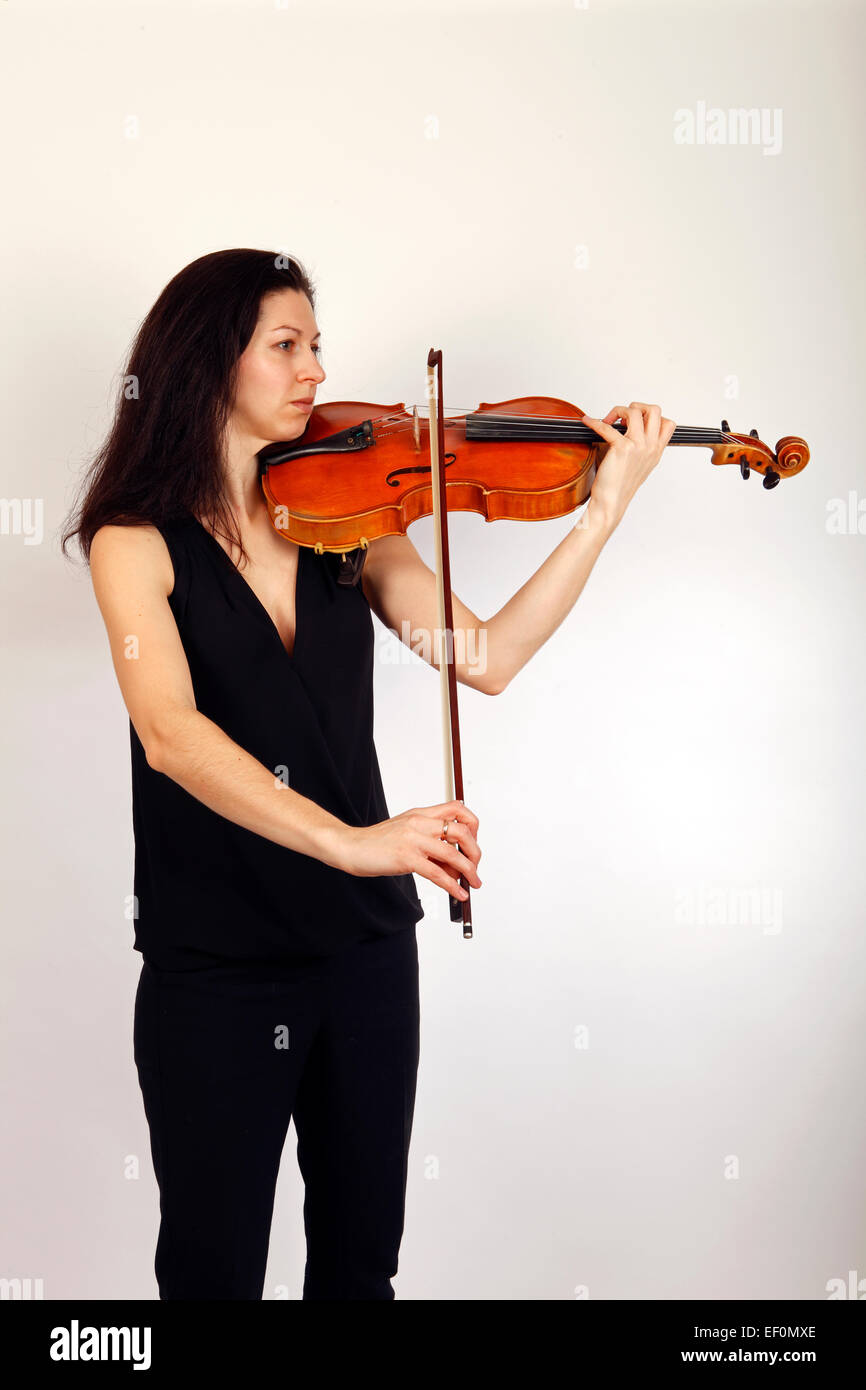 Viola player, playing her musical instrument Stock Photo - Alamy