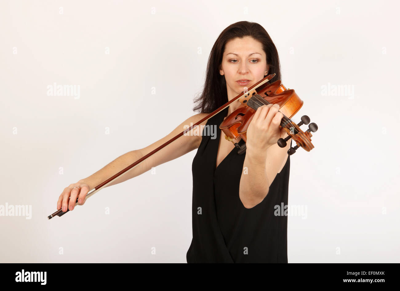Viola player, playing her musical instrument Stock Photo - Alamy