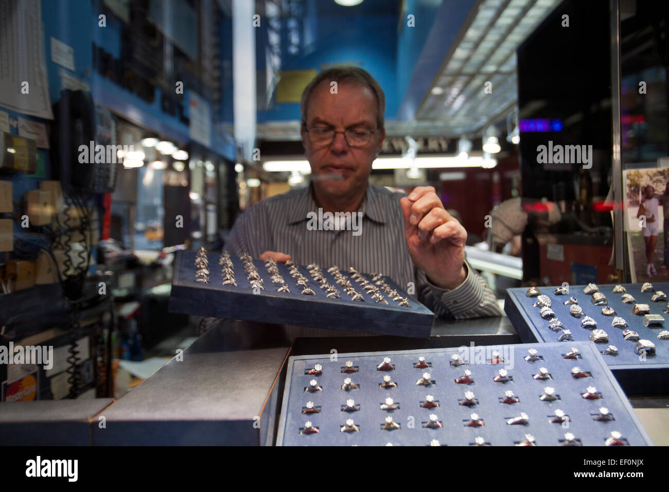 Jew diamond dealer working on ring display at window of his shop in ...